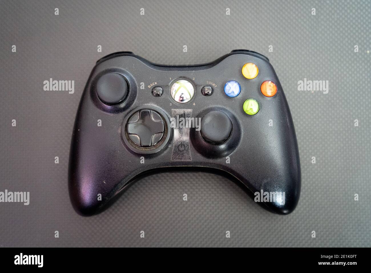 the Xbox controller on a carbon fiber background showing technology of ...