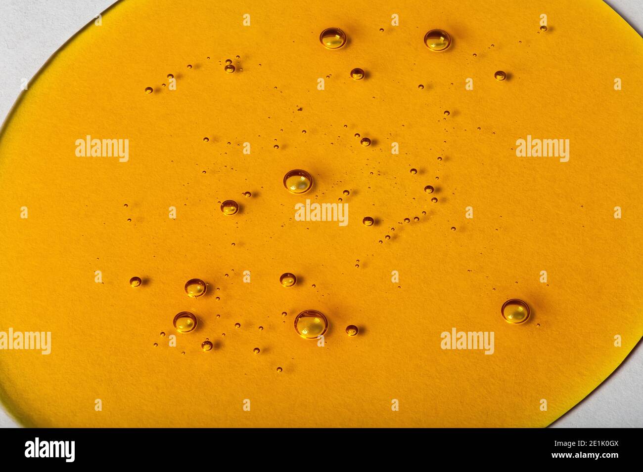 Yellow viscous liquid lecithin with bubbles on glass Stock Photo - Alamy