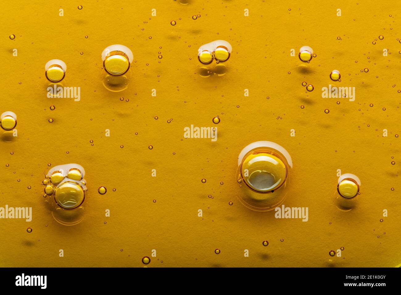 Yellow viscous liquid lecithin with bubbles on glass Stock Photo - Alamy