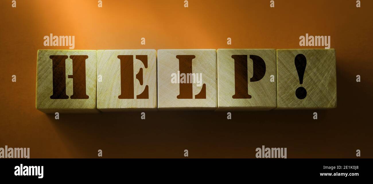 HELP word and Exclamation marks on wooden blocks. on a red background ...