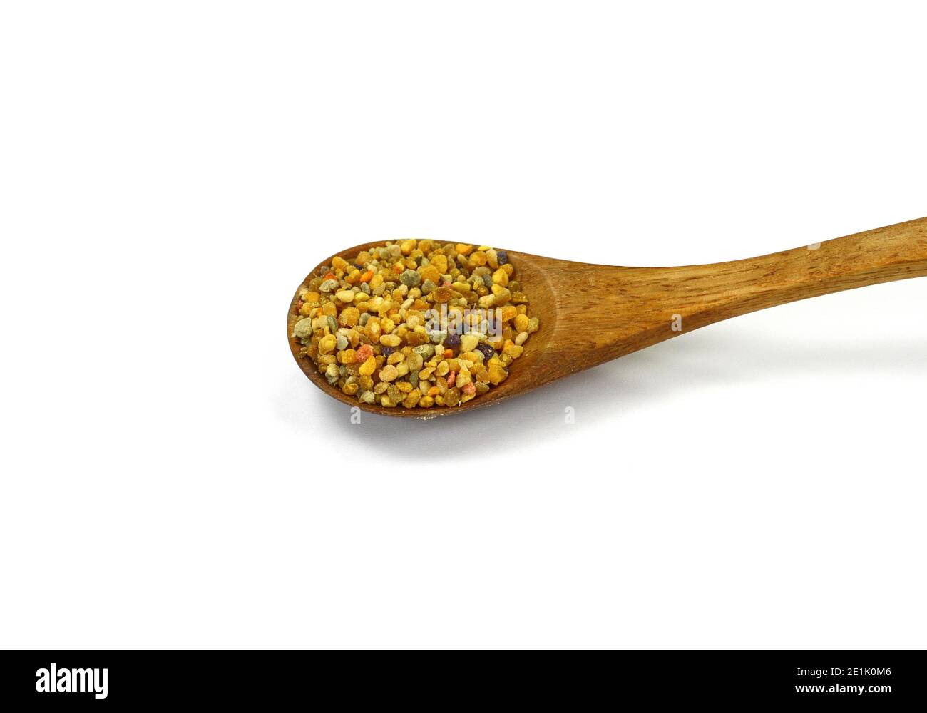 Pile of bee pollen in a wooden spoon isolated on white Stock Photo - Alamy