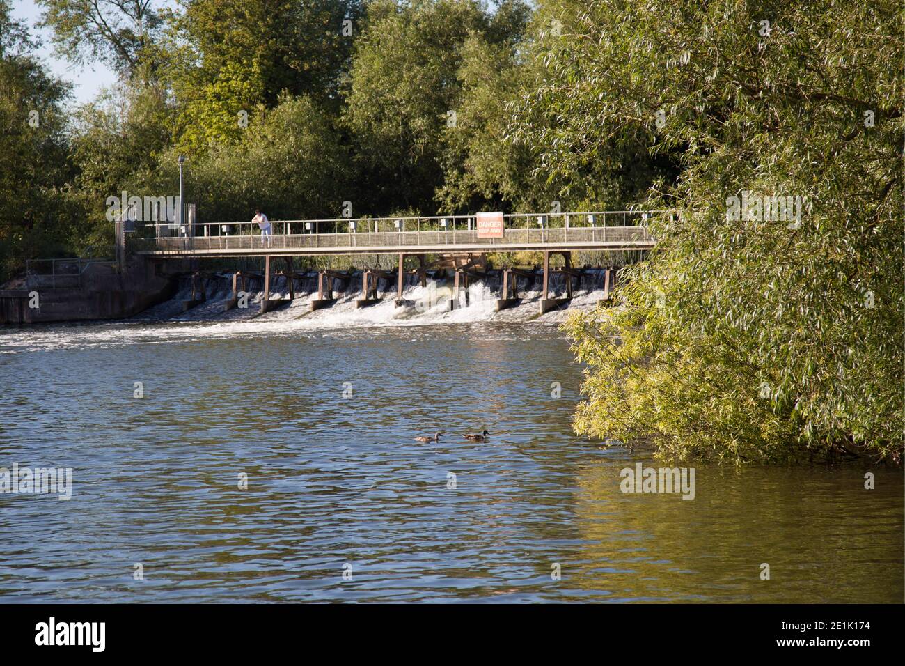 Water powering over the weir at Abingdon Lock, on the River Thames ...