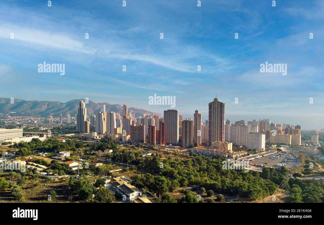 Skyscrapers of Benidorm city during sunny day view over blue cloudy sky ...