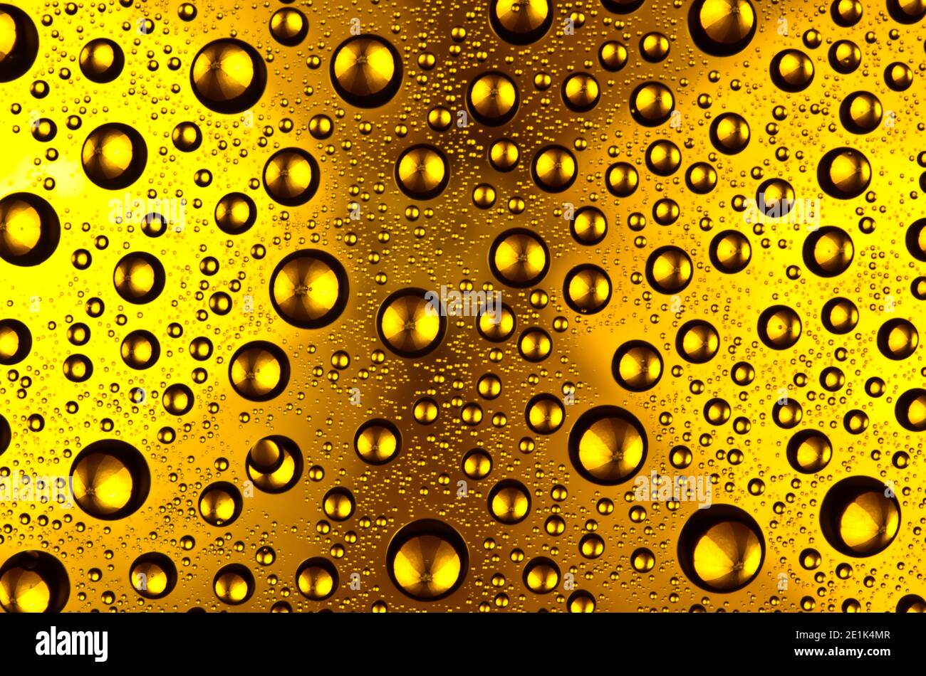 Orange fruit through drops on glass Stock Photo - Alamy