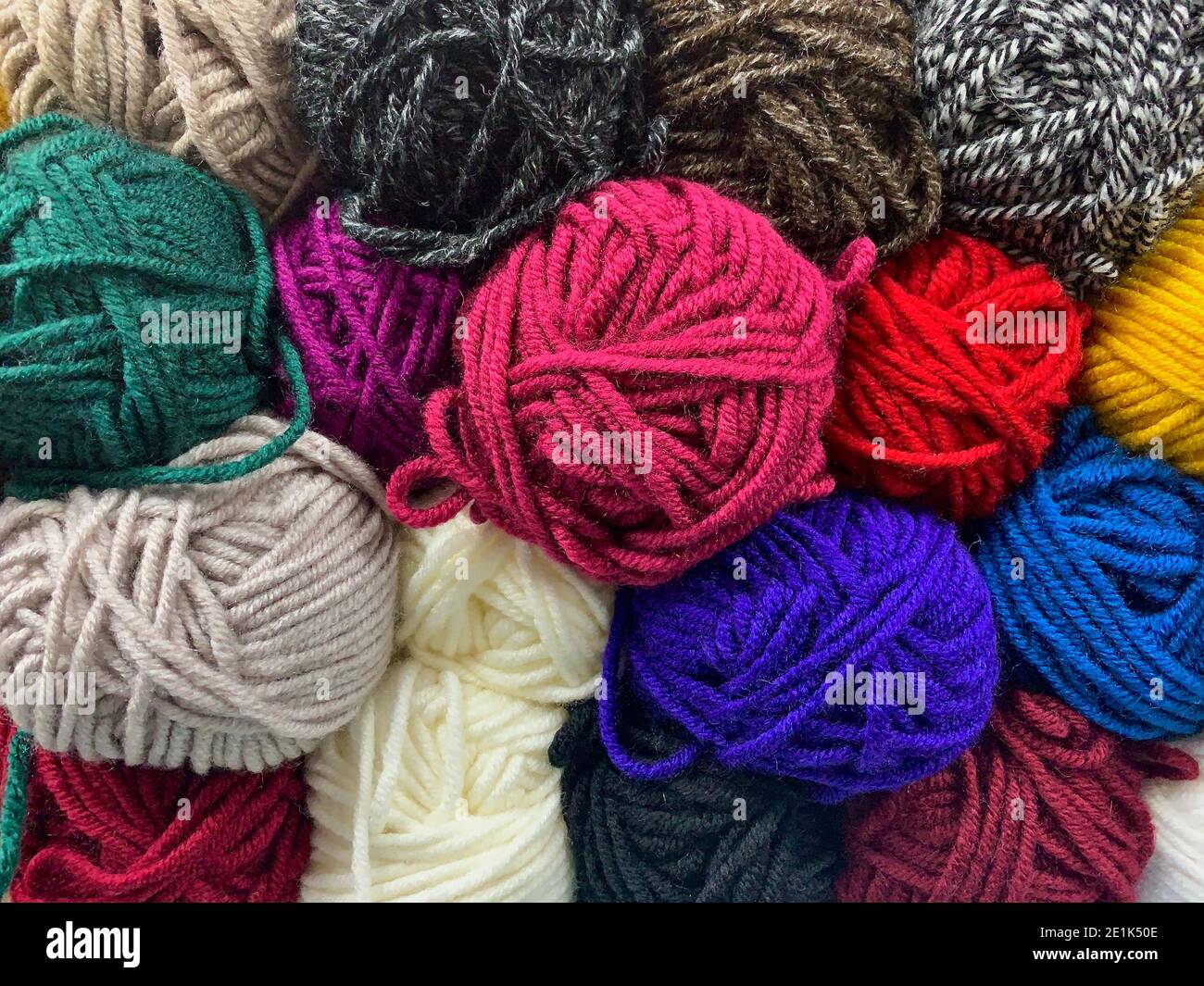 Multi colored and different textured yarn for knitting, stacked on top ...