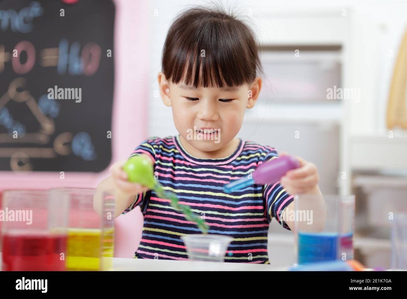 young girl play science experiments for homeschooling Stock Photo - Alamy