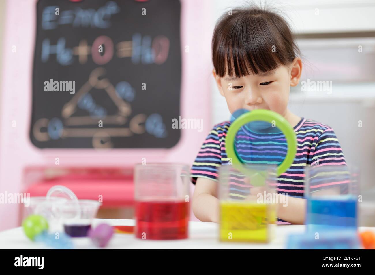 young girl play science experiments for homeschooling Stock Photo - Alamy
