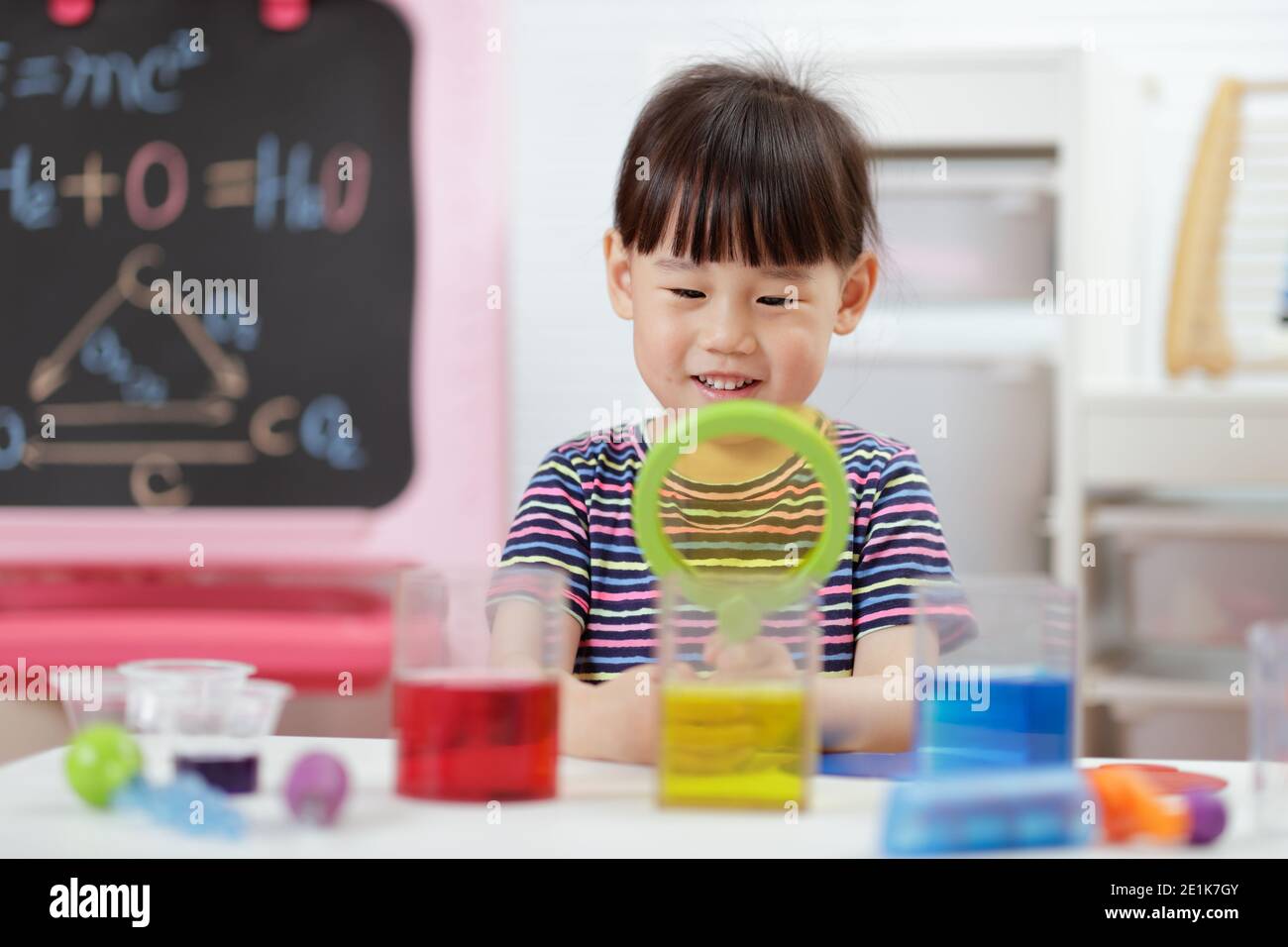 young girl play science experiments for homeschooling Stock Photo - Alamy