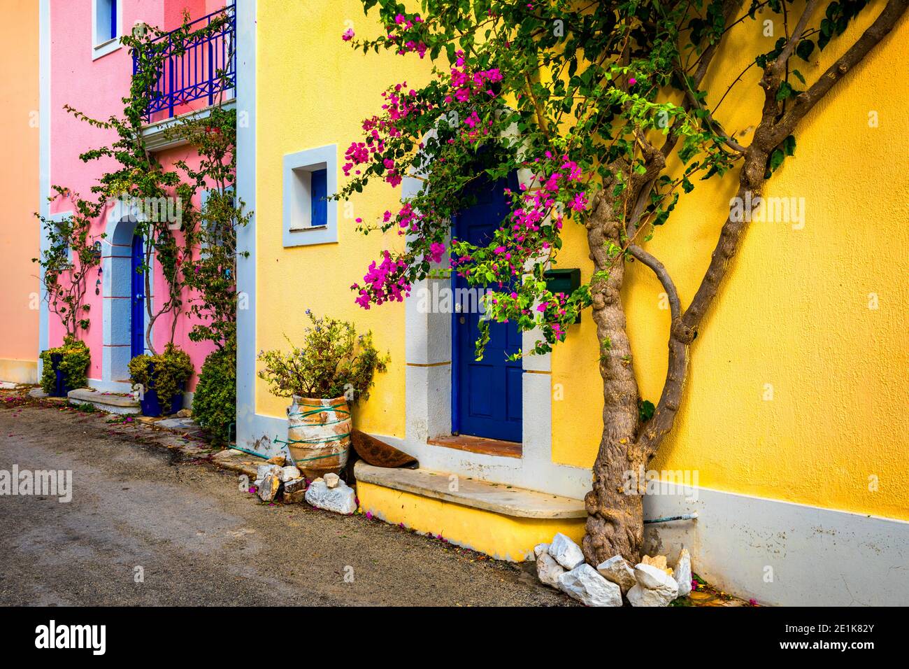 Traditional street with greek houses with flowers in Assos, Kefalonia ...