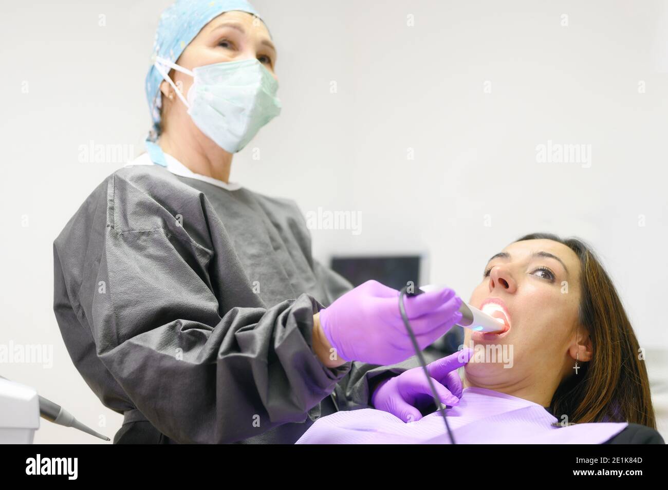 Dentist examining patients tooth intraoral hi-res stock photography and ...