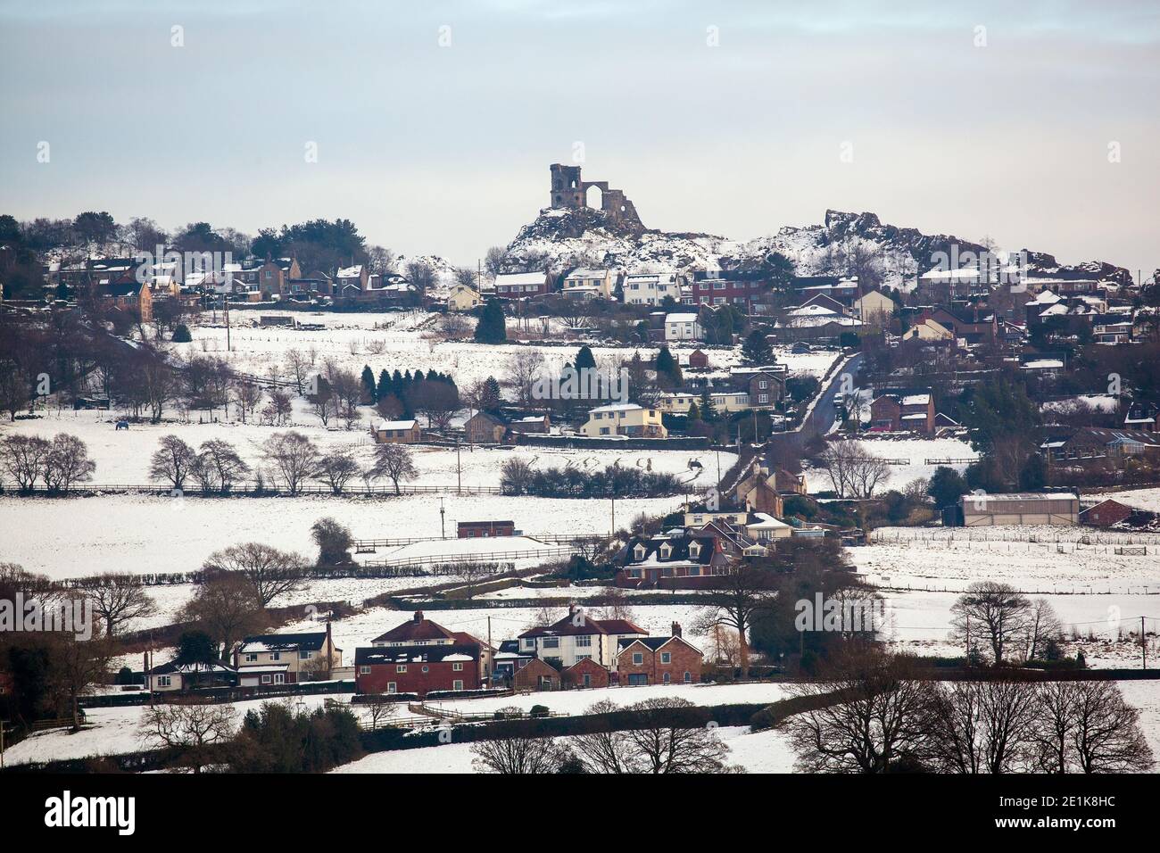 Mow Cop castle, the folly of a ruined castle in snow during winter ...