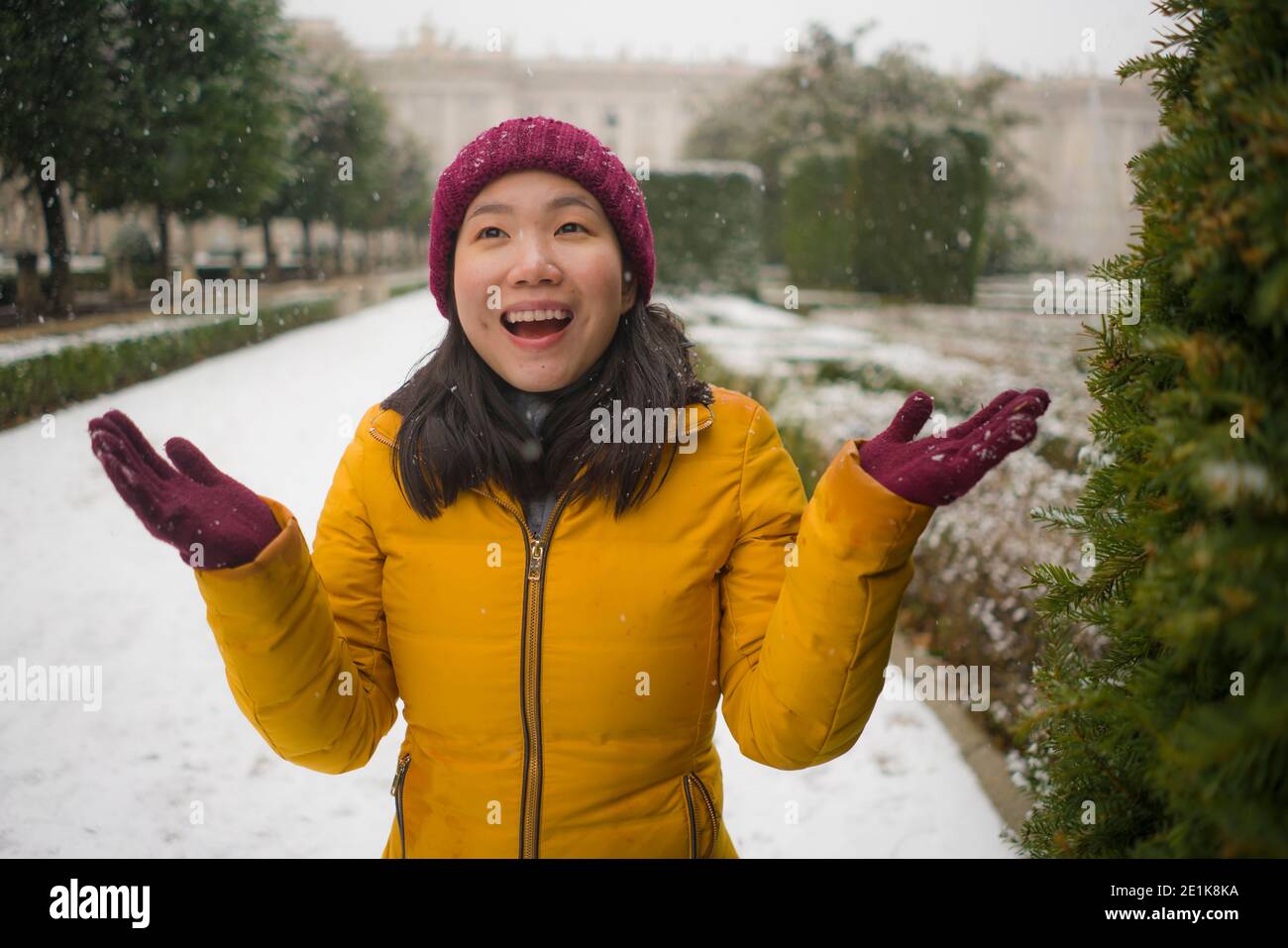 young happy and attractive Asian Japanese woman in Winter jacket and ...