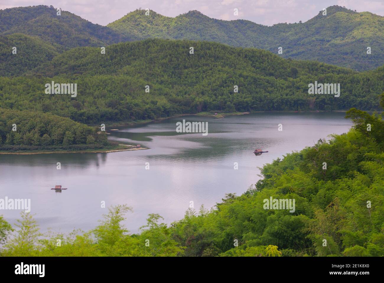 raft floating in dam againts mountain Stock Photo - Alamy