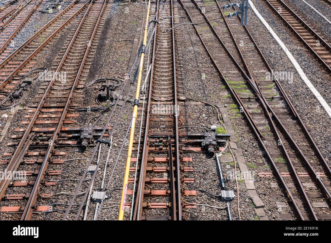 Picture of multi rails across to train moving Stock Photo - Alamy