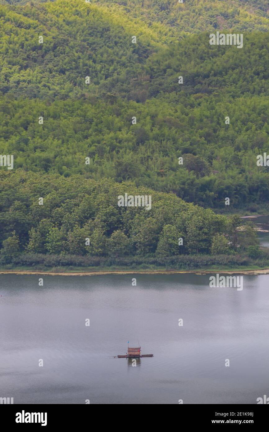 raft floating in dam againts mountain Stock Photo - Alamy
