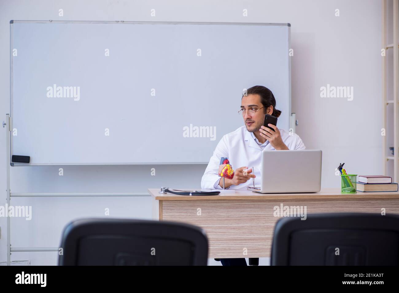 Young doctor giving seminar in the classroom Stock Photo - Alamy