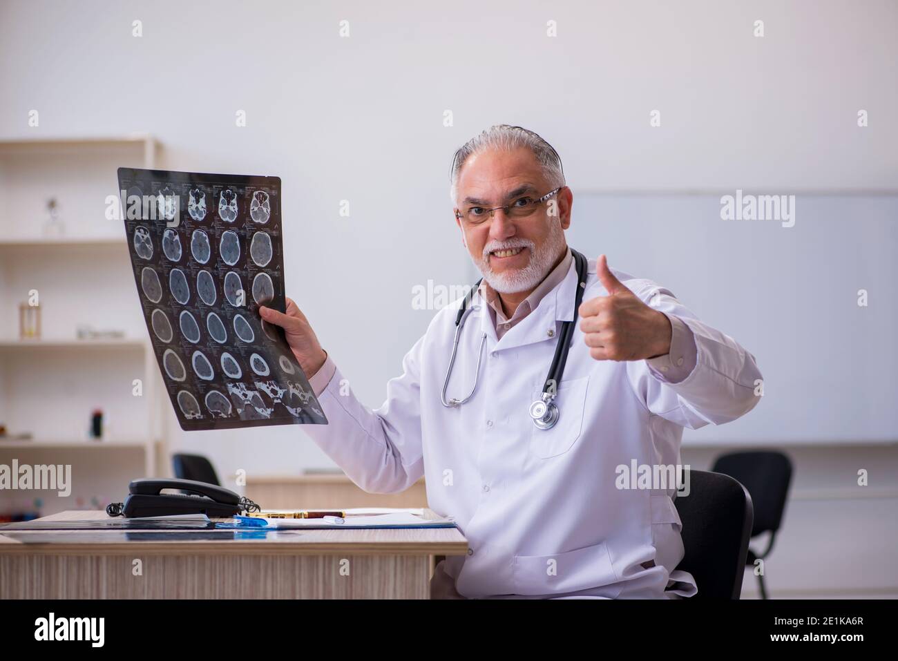 Old doctor radiologist working in the clinic Stock Photo - Alamy