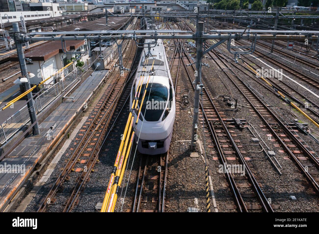 Picture of multi rails across to train moving Stock Photo - Alamy