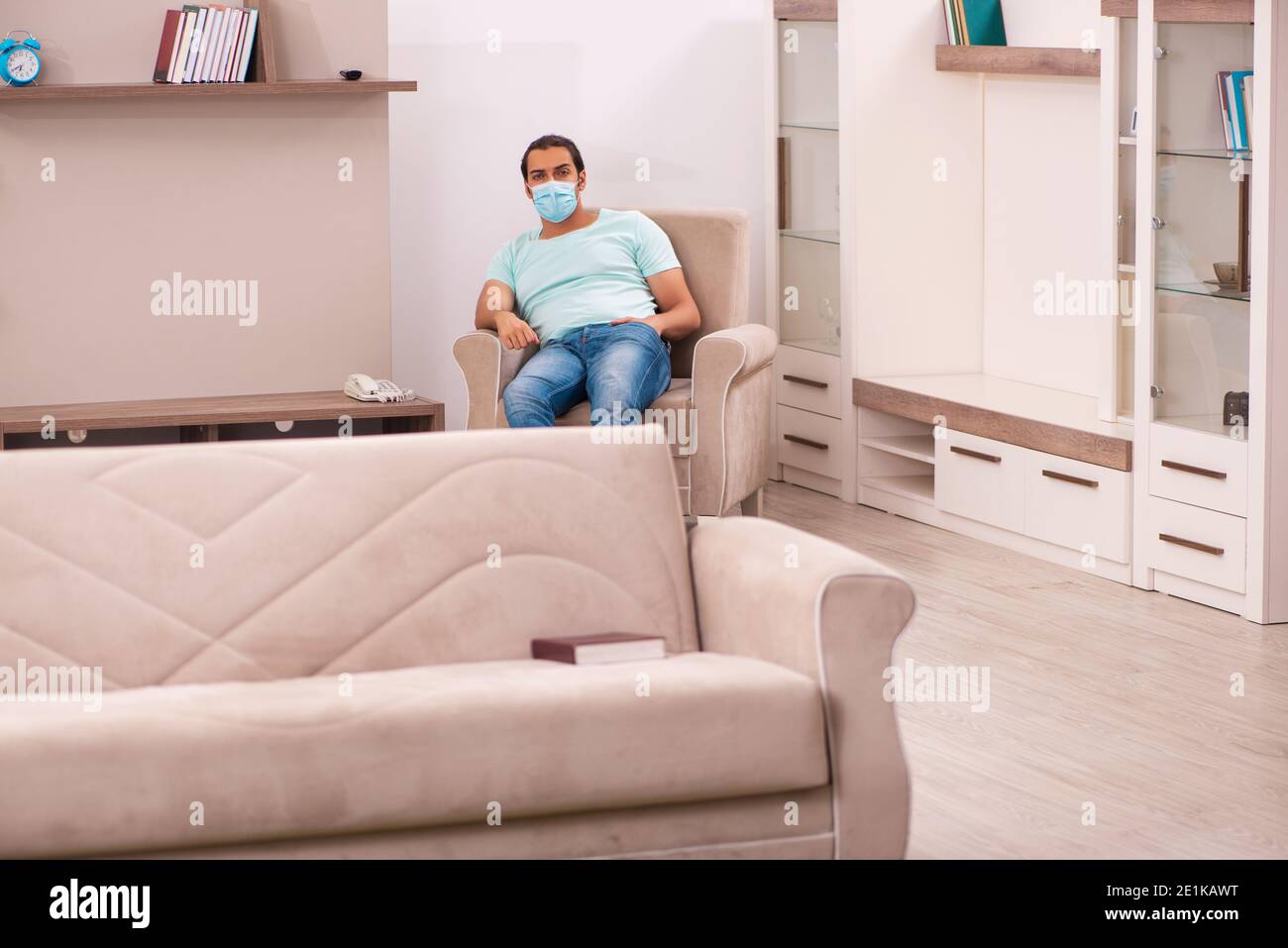 Young man boring at home during pandemic Stock Photo - Alamy
