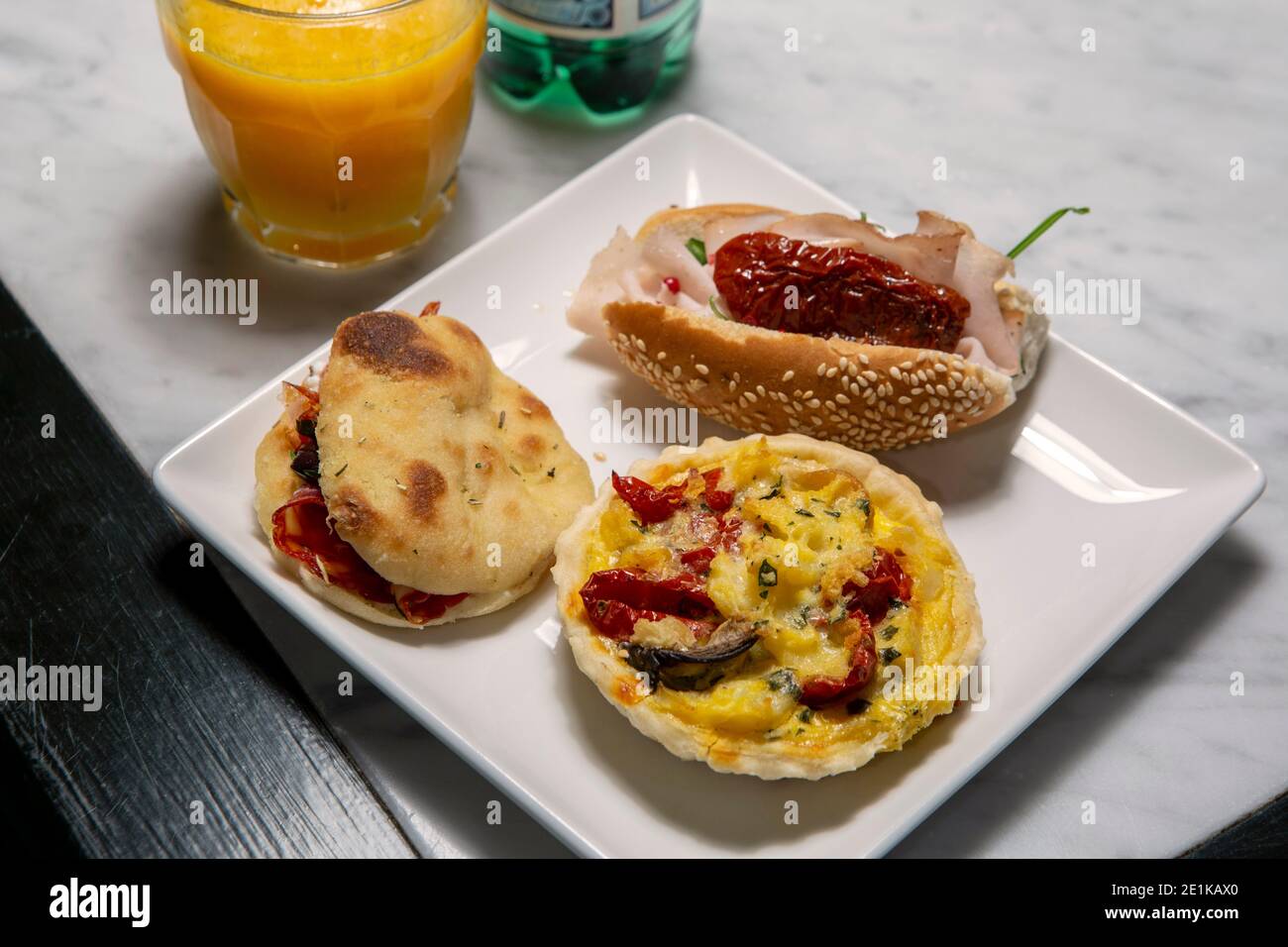 tasty filled bread rolls and orange juice Stock Photo - Alamy