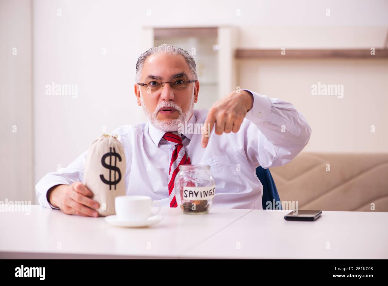 Senior male boss employee in retirement concept Stock Photo - Alamy