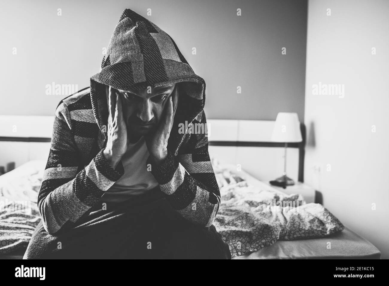 Sad man sitting on bed Black and White Stock Photos & Images - Alamy