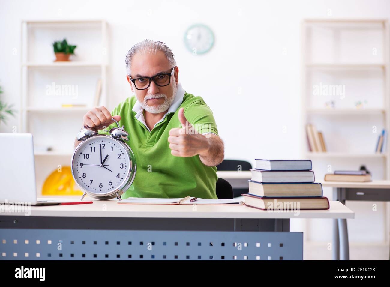 Teacher giving lesson senior student hi-res stock photography and ...