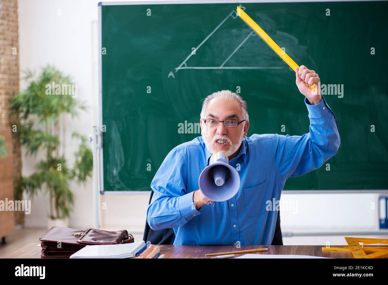 Angry teacher and ruler hi-res stock photography and images - Alamy