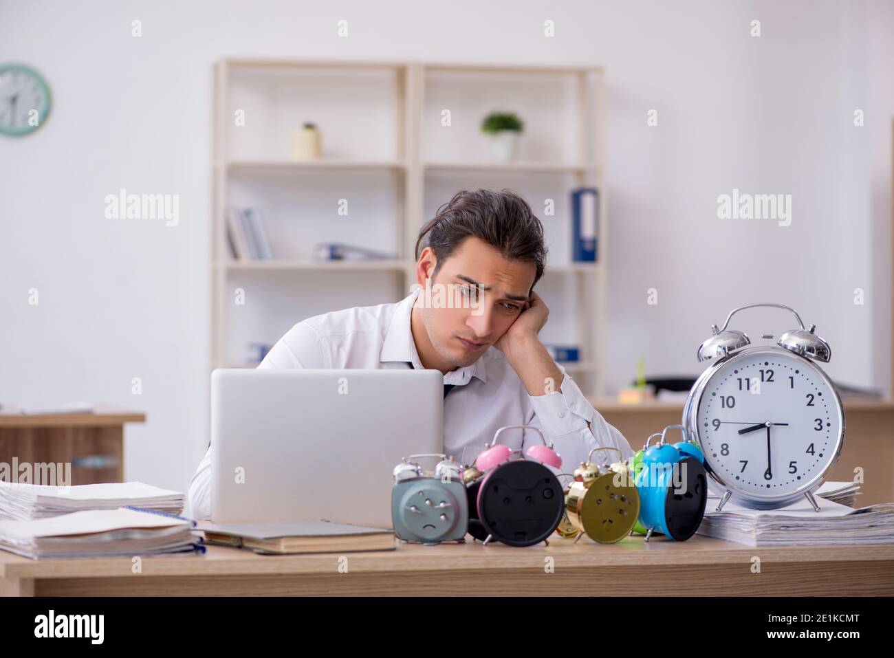 Young employee afraid of missing deadline at workplace Stock Photo - Alamy