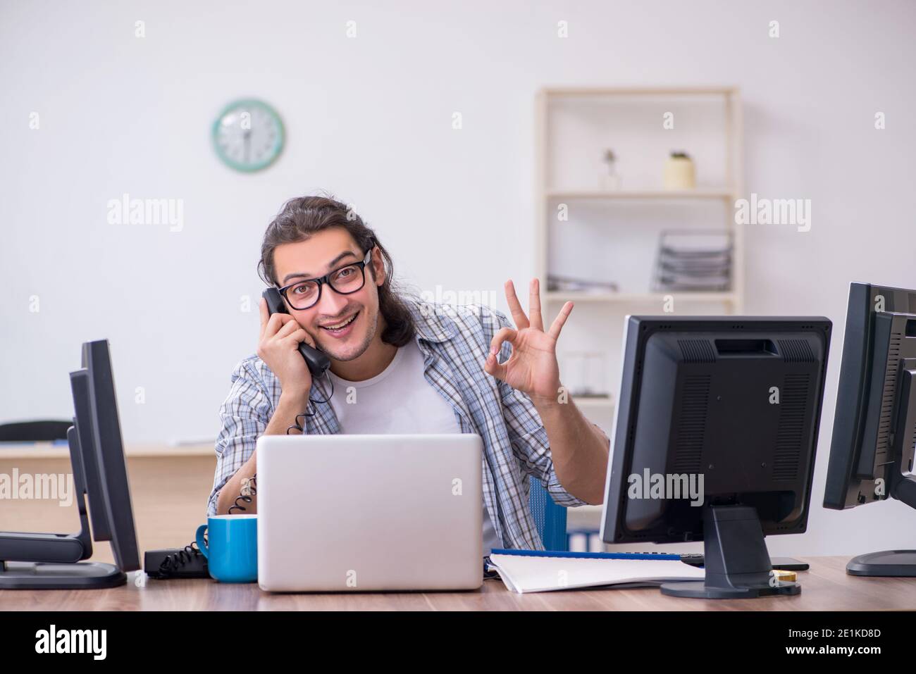 Male it specialist working in the office Stock Photo - Alamy