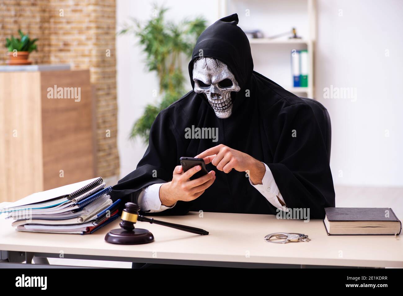Devil judge working in the courthouse Stock Photo - Alamy