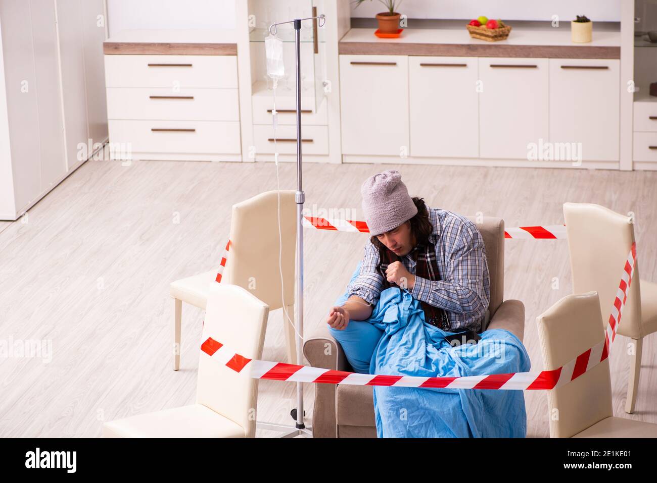 Sick man suffering at home in pandemic concept Stock Photo - Alamy