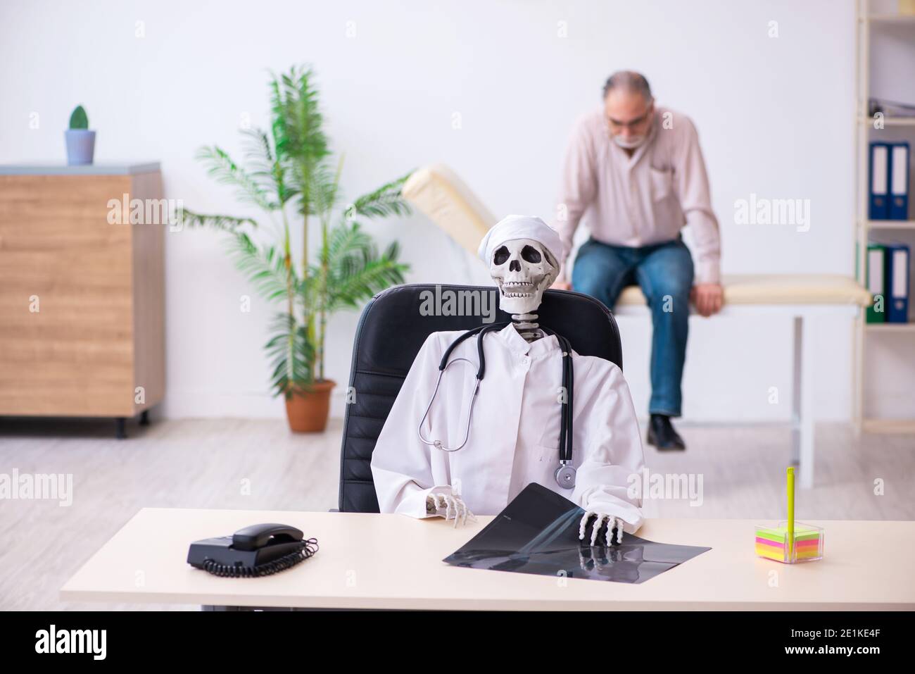 Skeleton doctor in funny medical concept Stock Photo - Alamy