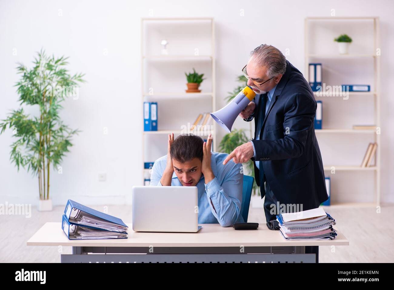 Old boss and young assistant in the office Stock Photo - Alamy