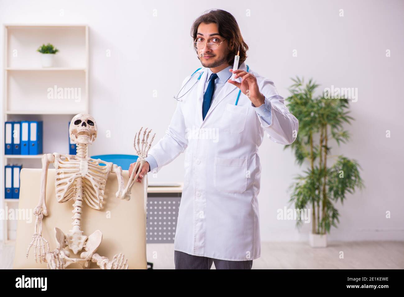Crazy doctor examining the dead patient Stock Photo - Alamy