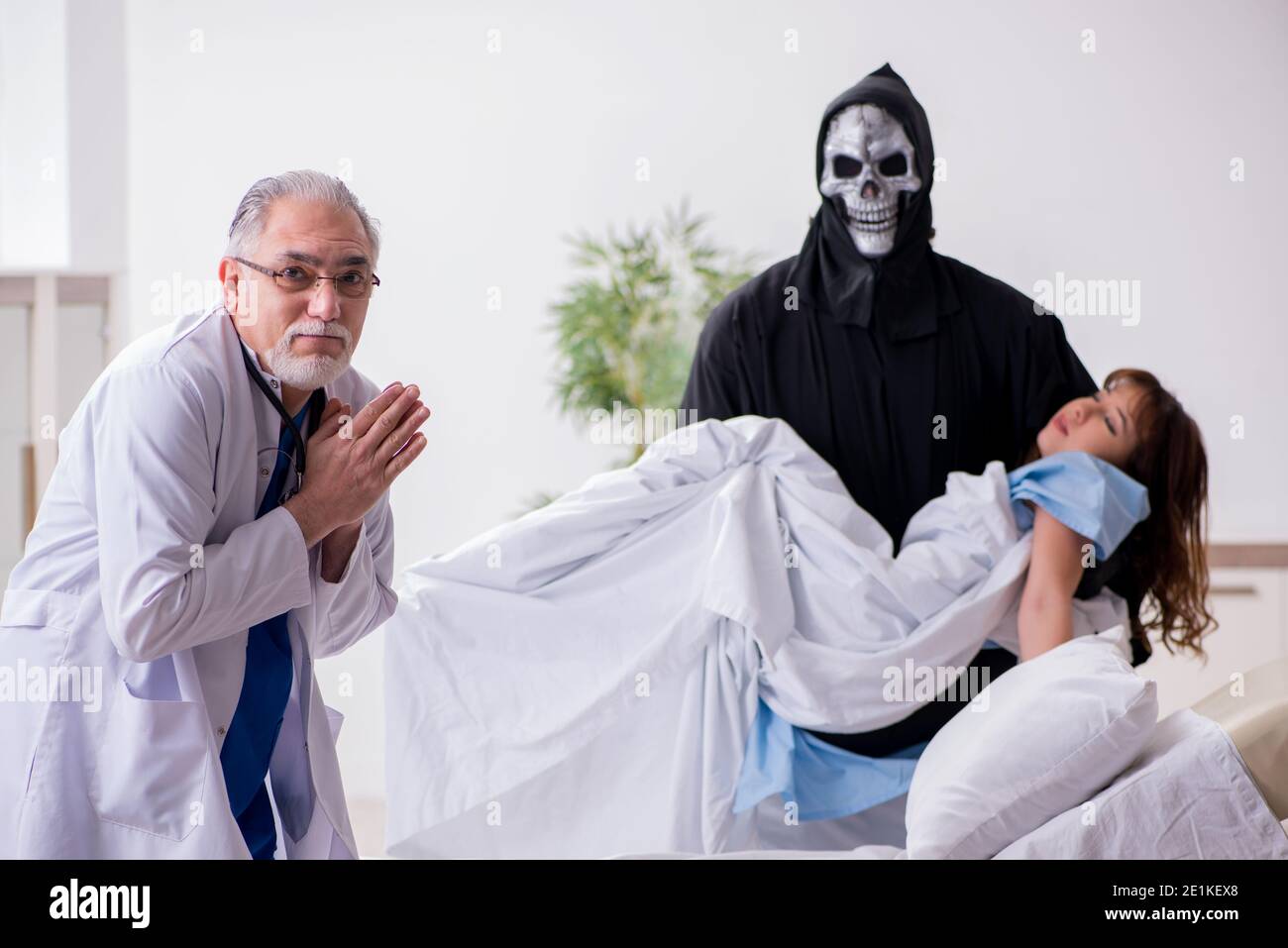 Devil, old doctor and female patient in clinic Stock Photo - Alamy