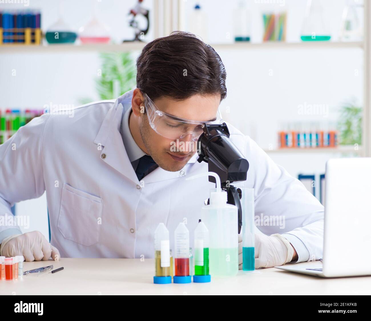 The male biochemist working in the lab on plants Stock Photo - Alamy