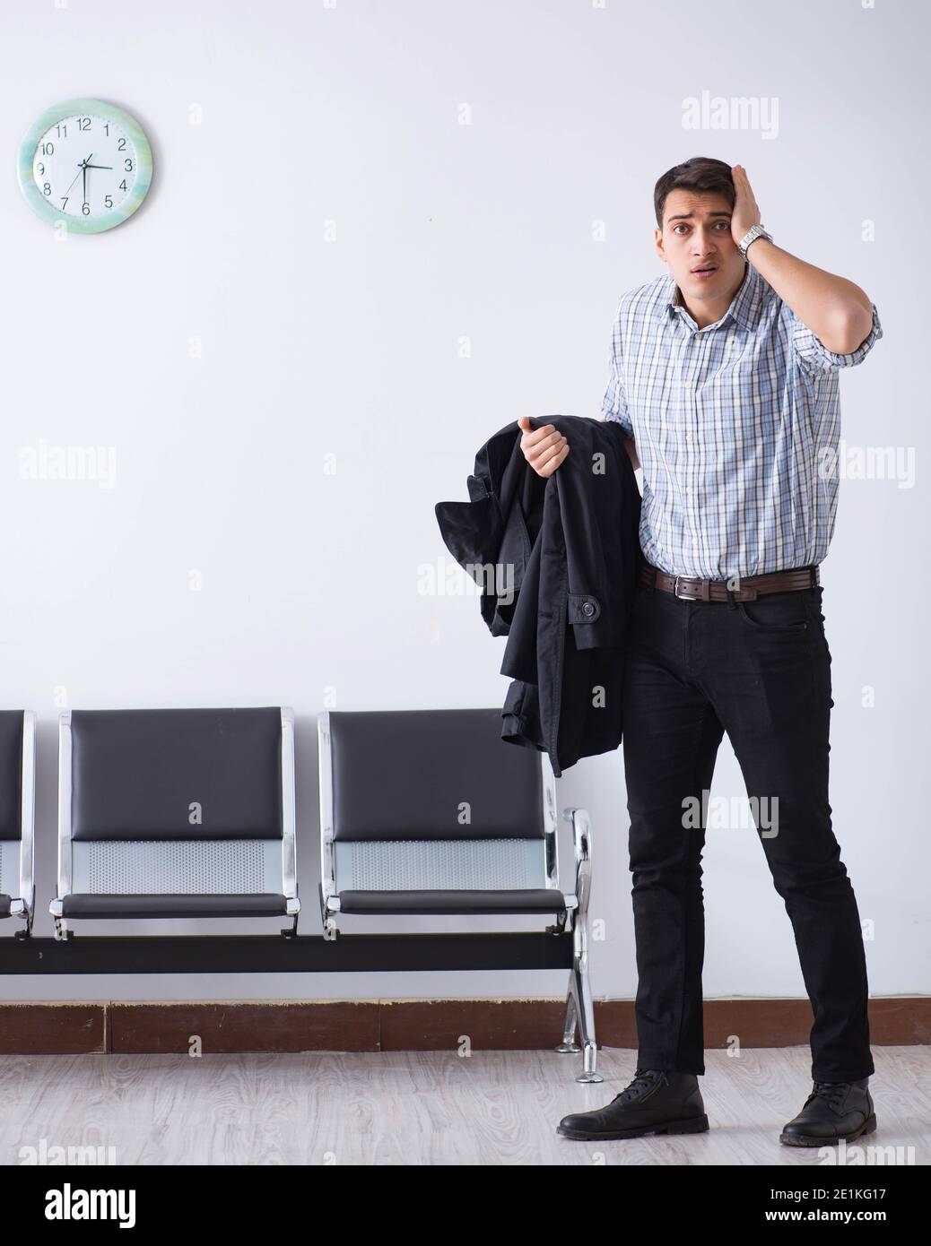 The man nervously impatiently waiting in the lobby Stock Photo - Alamy