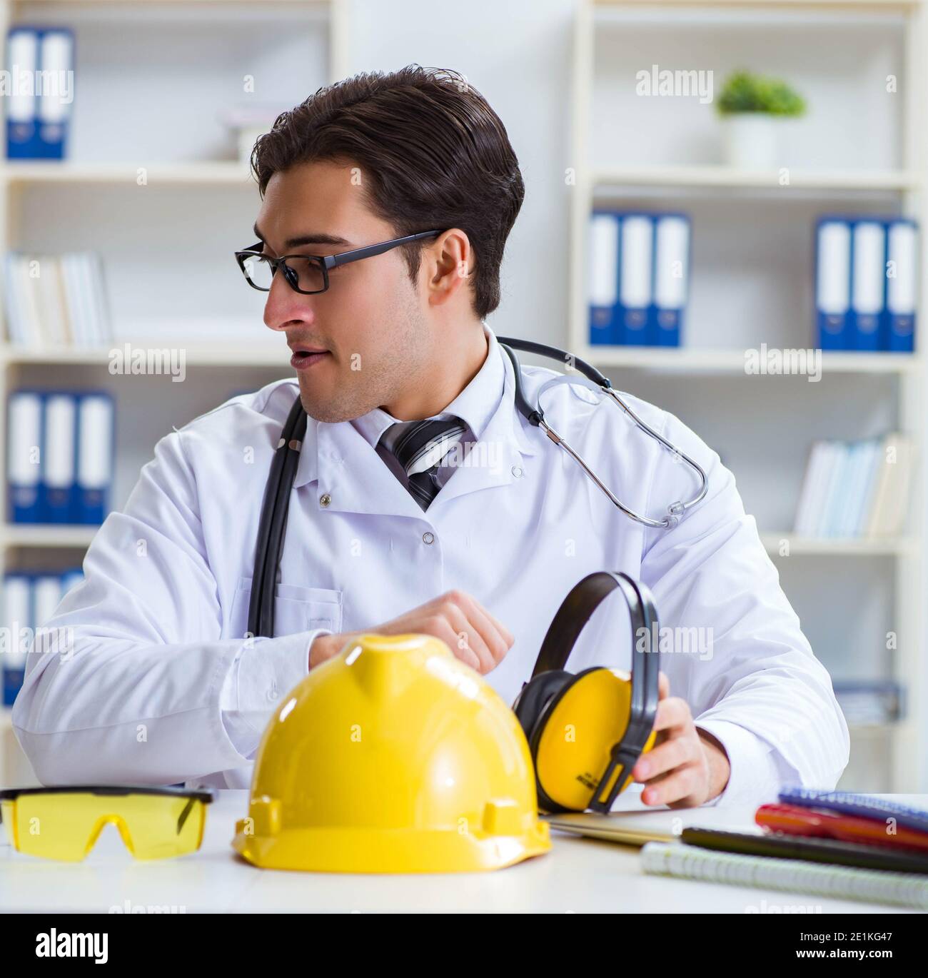 The safety doctor advising about noise cancelling headphones Stock ...