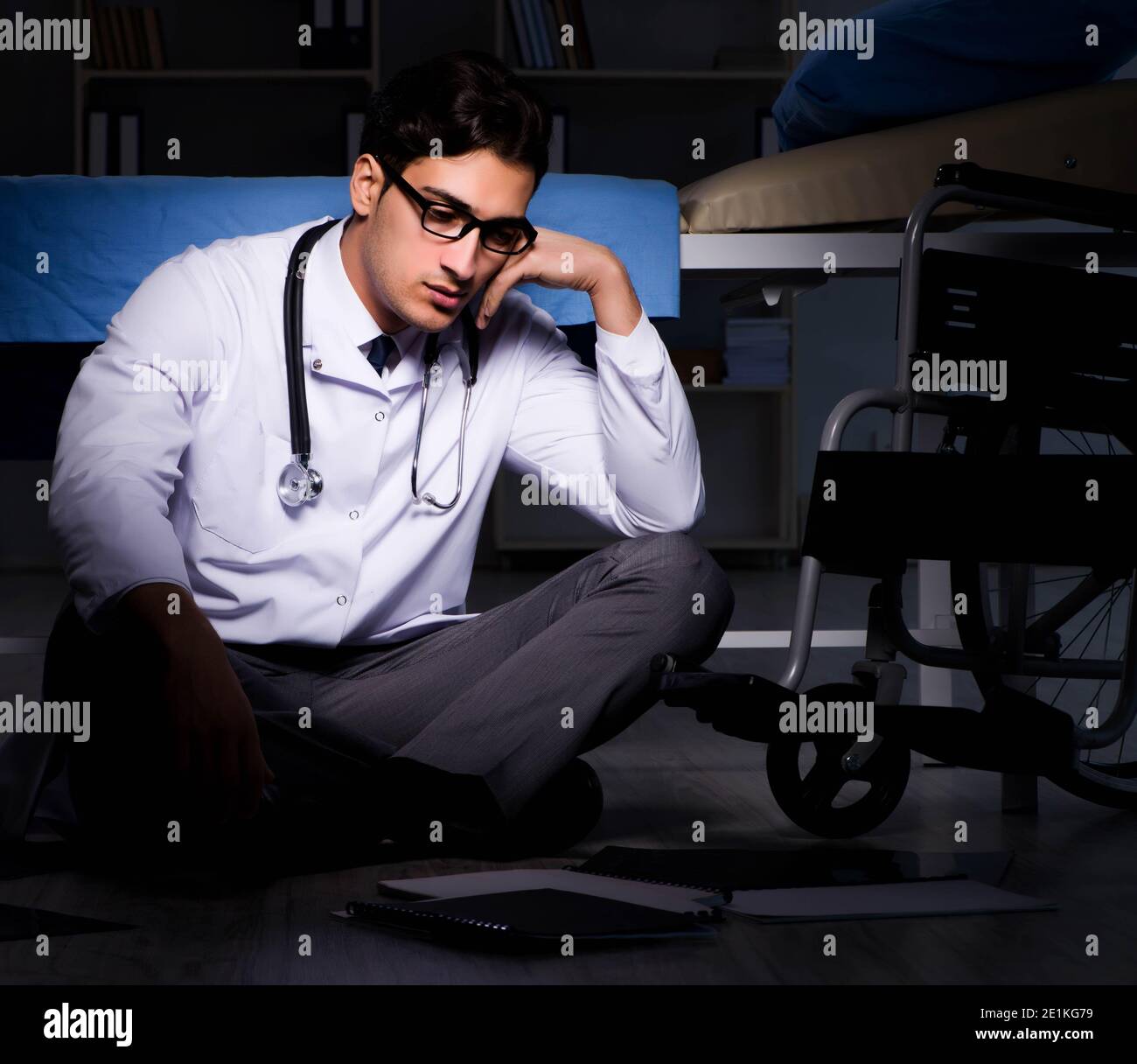 The doctor working night shift in hospital after long hours Stock Photo ...