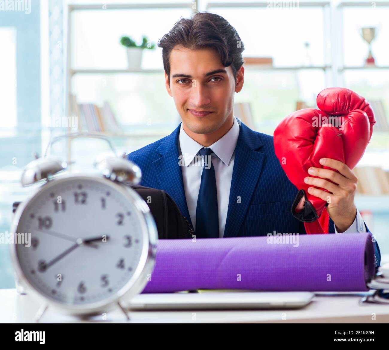 The man with boxing gloves in the office Stock Photo - Alamy