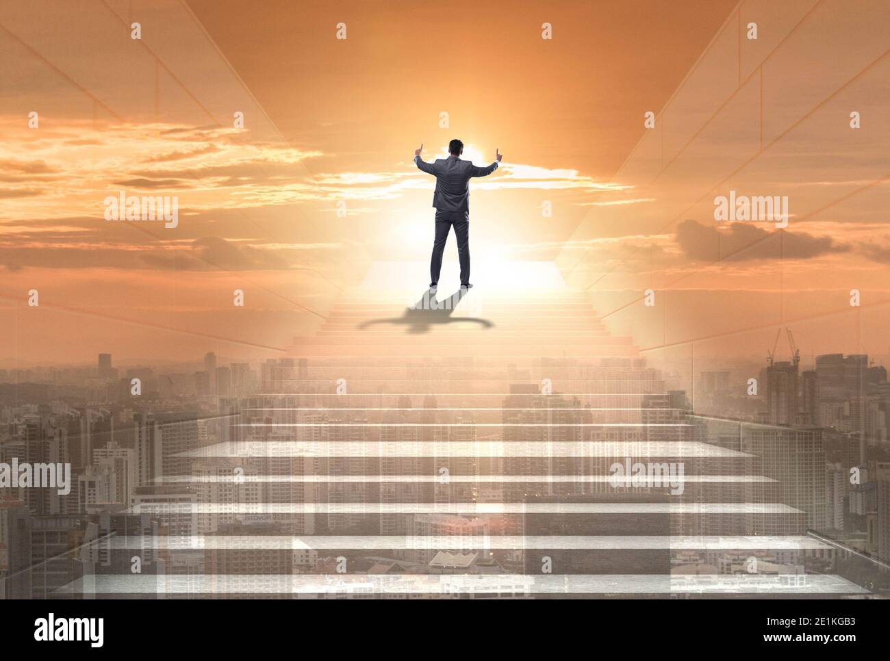 Businessman climbing up challenging career ladder in business concept ...