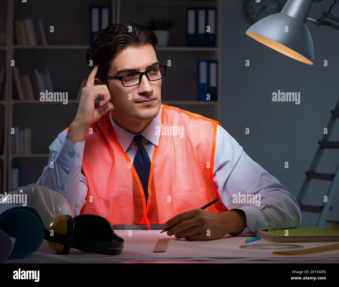 The construction architect working on drawings late at night Stock ...