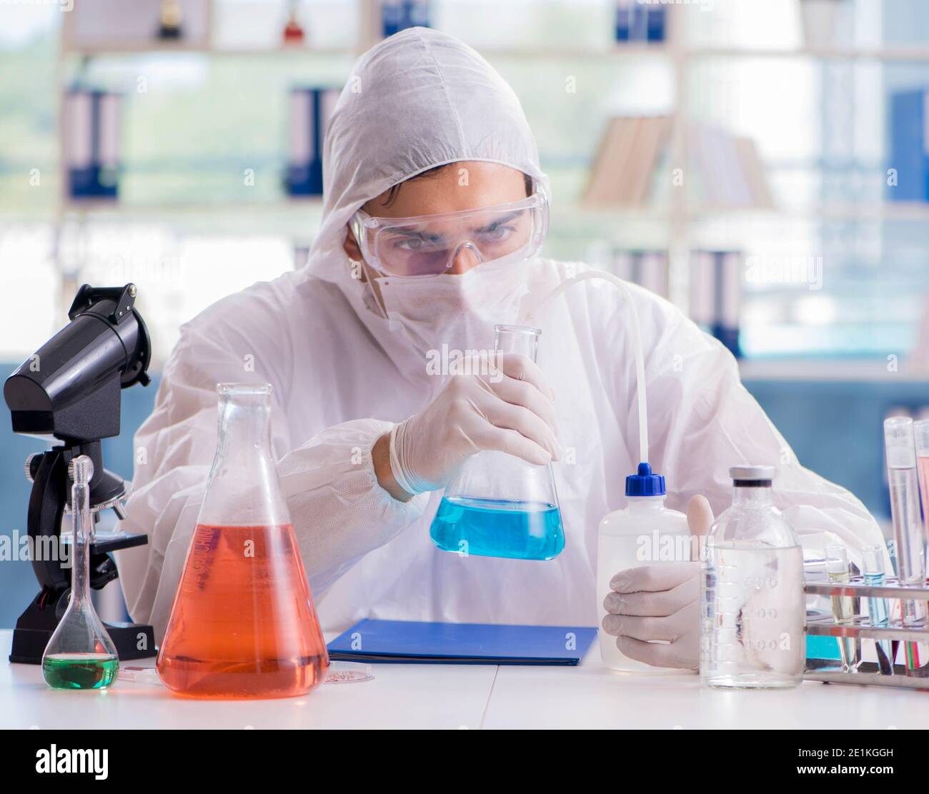 The chemist working in the laboratory with hazardous chemicals Stock ...