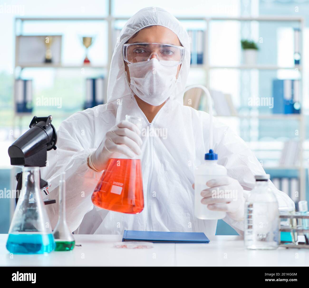 The chemist working in the laboratory with hazardous chemicals Stock ...