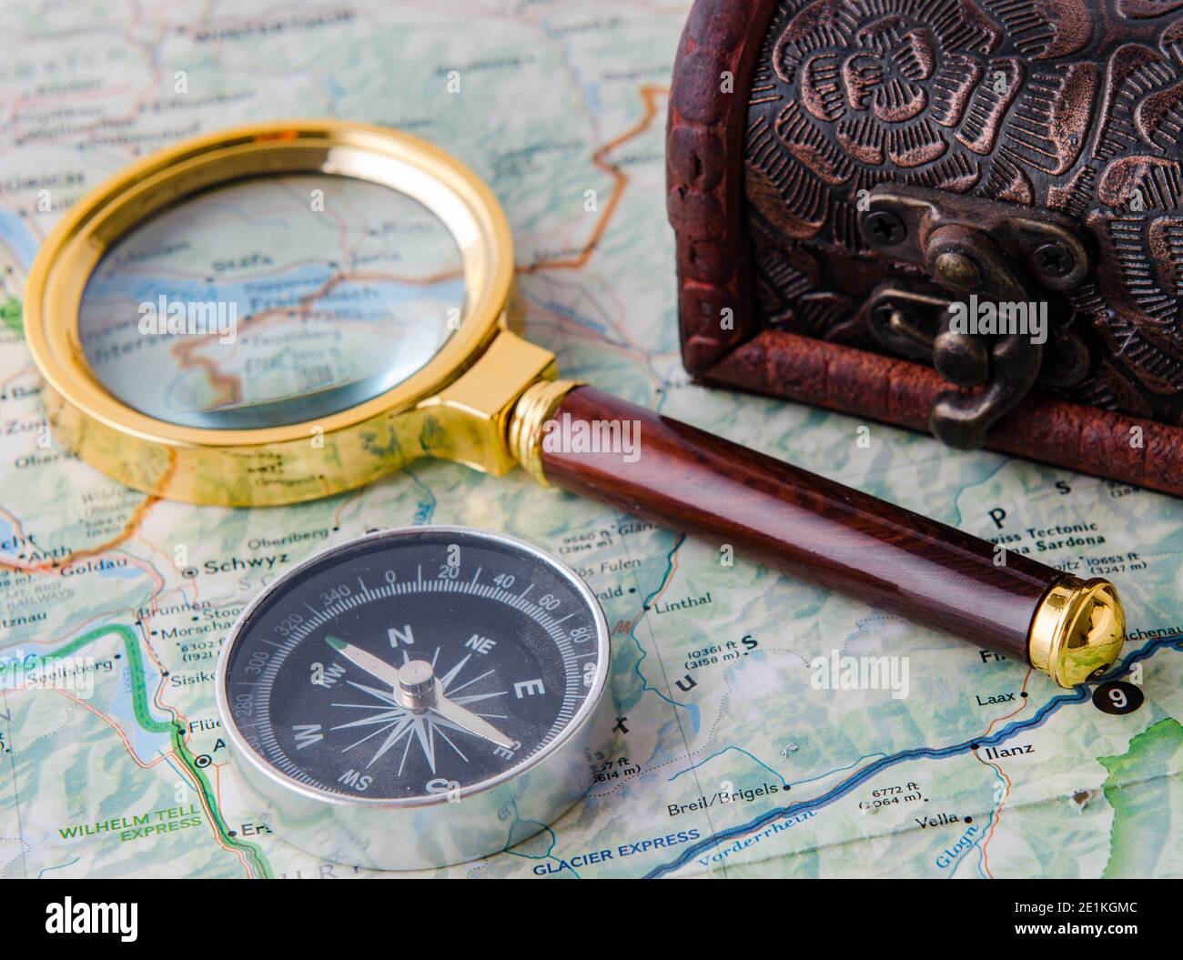 The travel concept with compass and map Stock Photo - Alamy