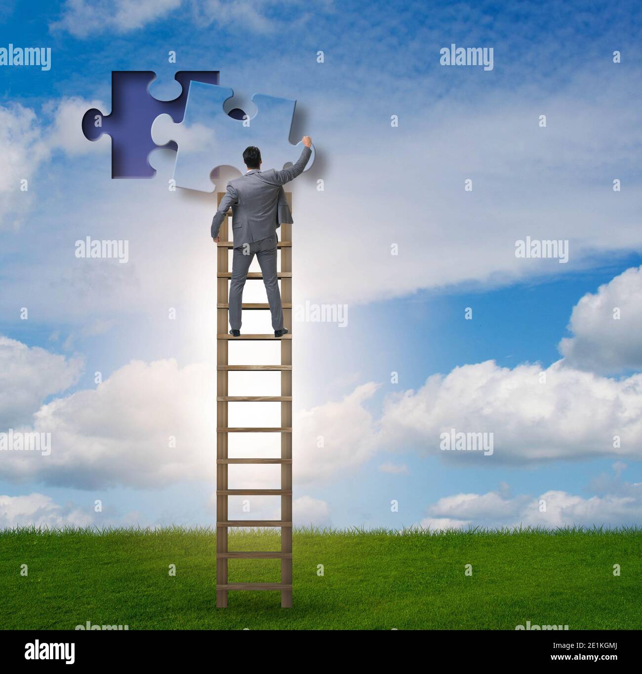 The businessman putting together jigsaw puzzle pieces Stock Photo - Alamy
