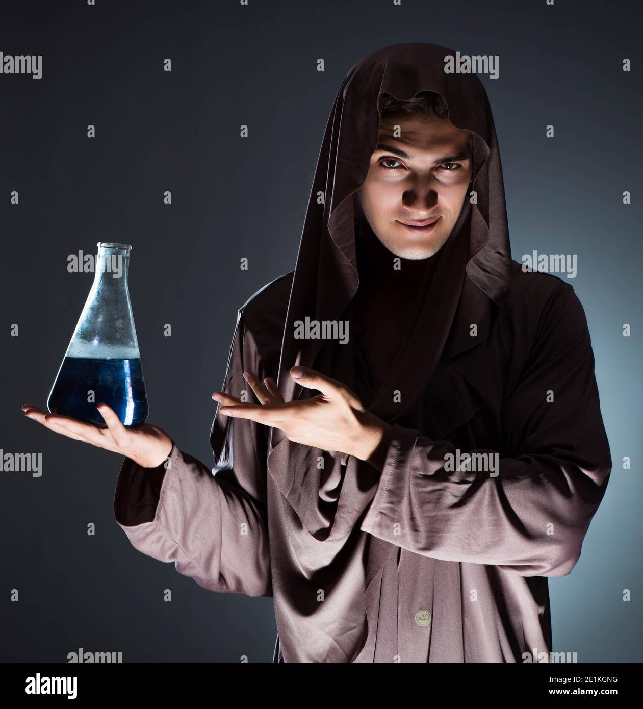 The alchemist doing experiments in alchemy concept Stock Photo - Alamy