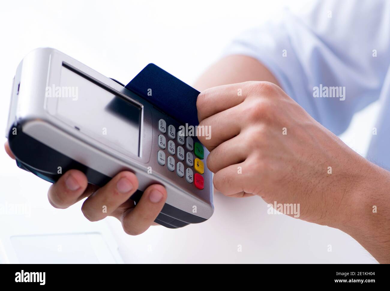 The man processing credit card transaction with pos terminal Stock ...
