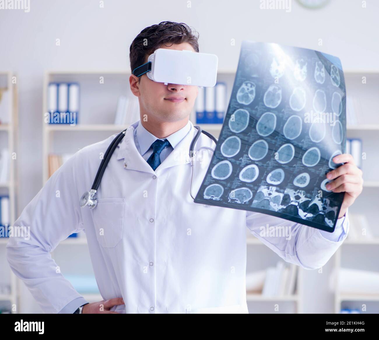 The young doctor looking at mri scan through vr glasses Stock Photo - Alamy